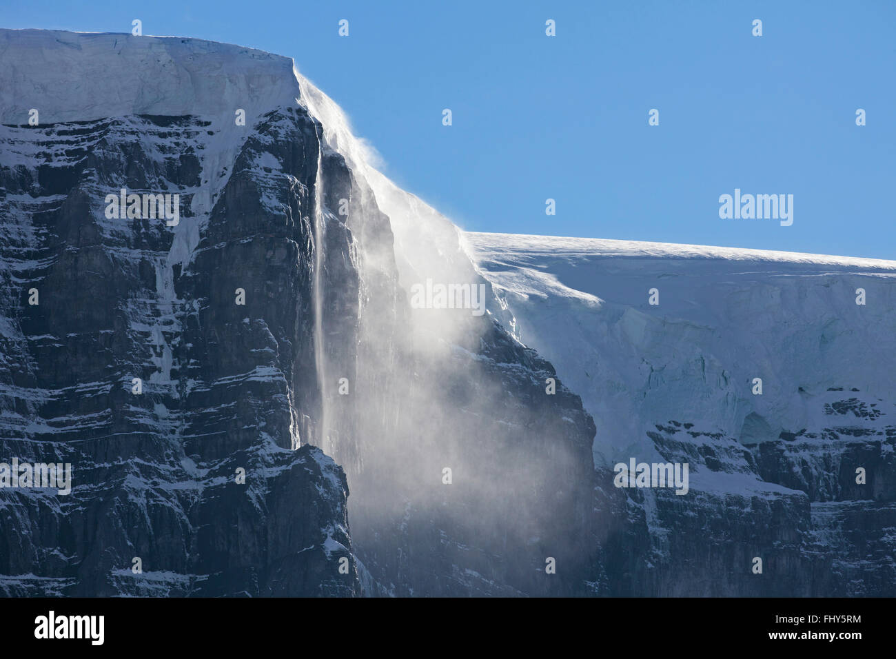 Snow blowing over cornices at Mount Kitchener, Jasper National Park ...