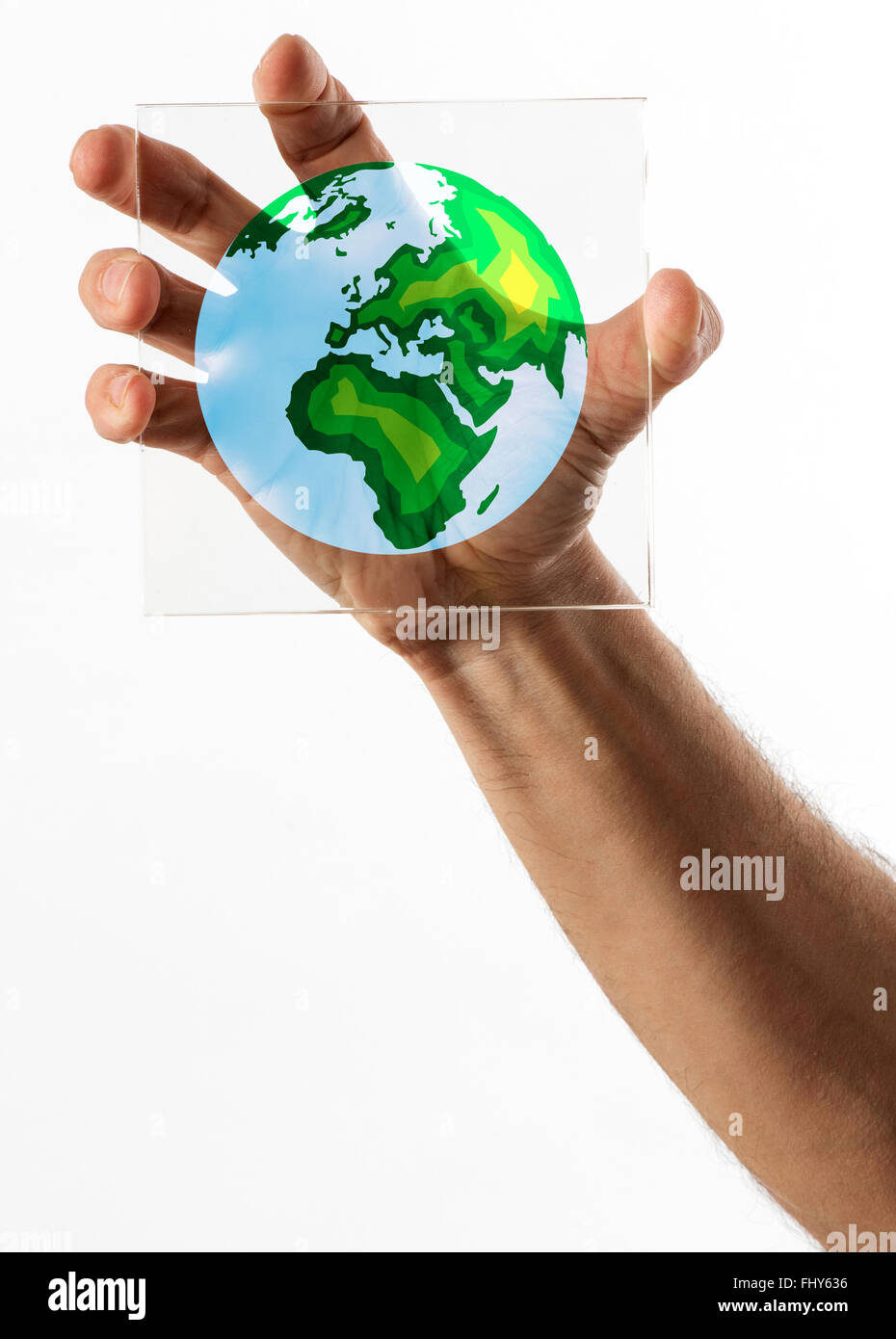 Planet Earth symbol on piece of square shaped glass held in a single ...