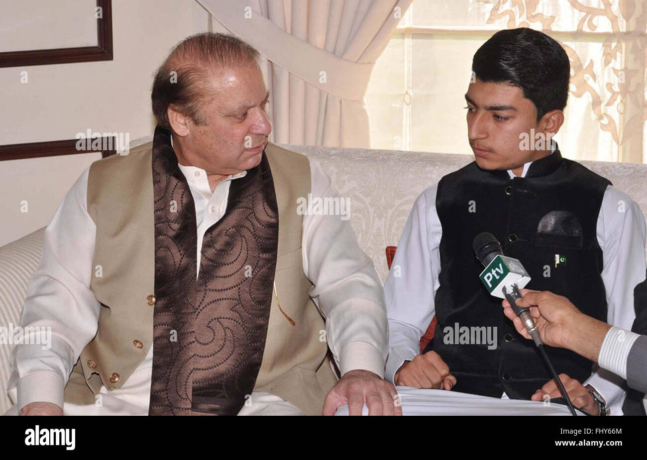 Prime Minister Muhammad Nawaz Sharif talks with Anwar Ullah Khan, an ...