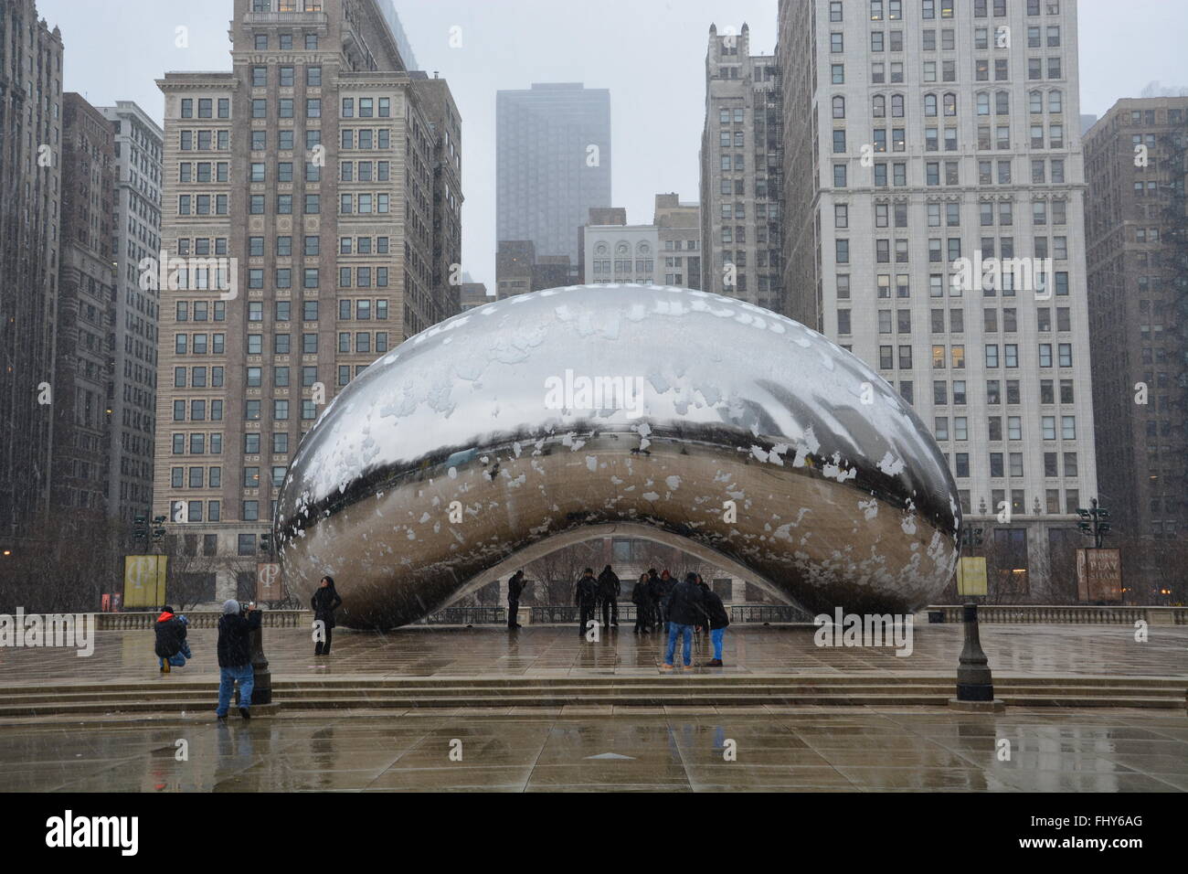 A light snow sticks to The Bean or Cloud Gate sculpture in Millennium ...