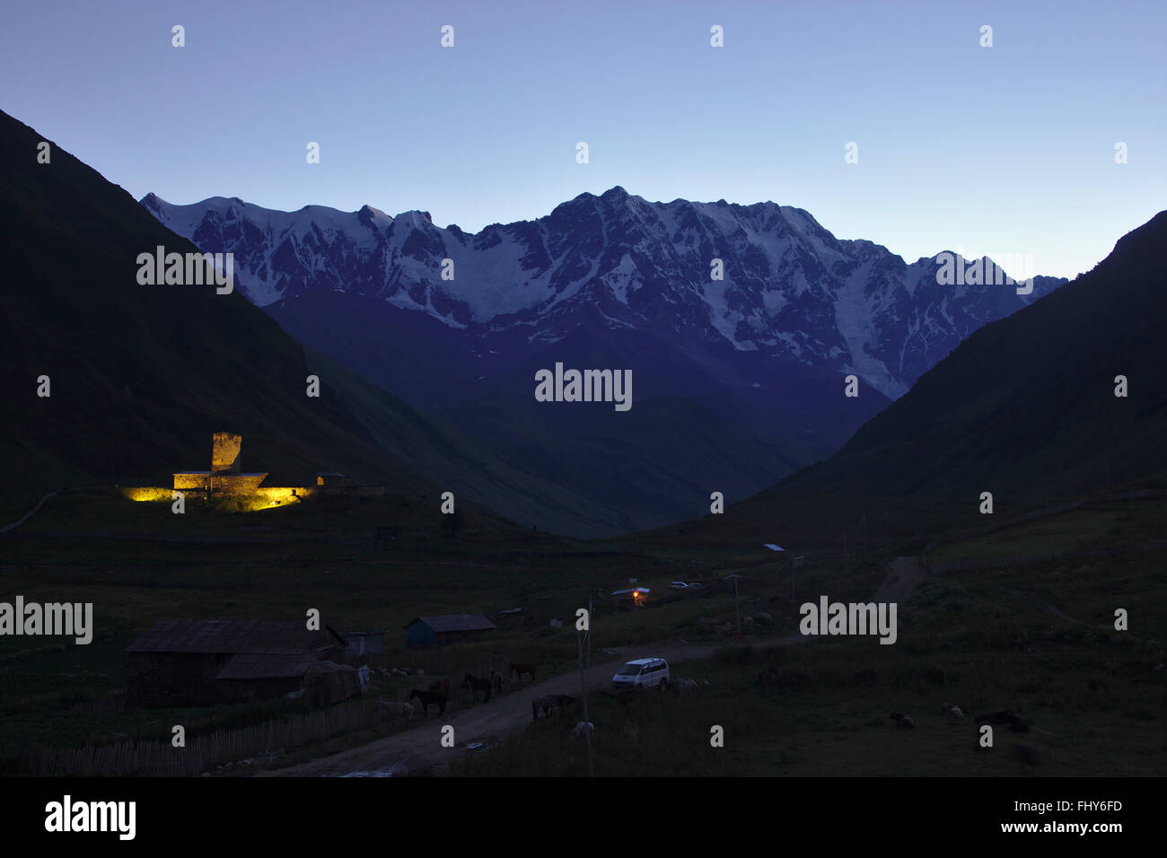 Usguli at dawn, illuminated Lamaria church and Mount Shkhara, Svaneti ...