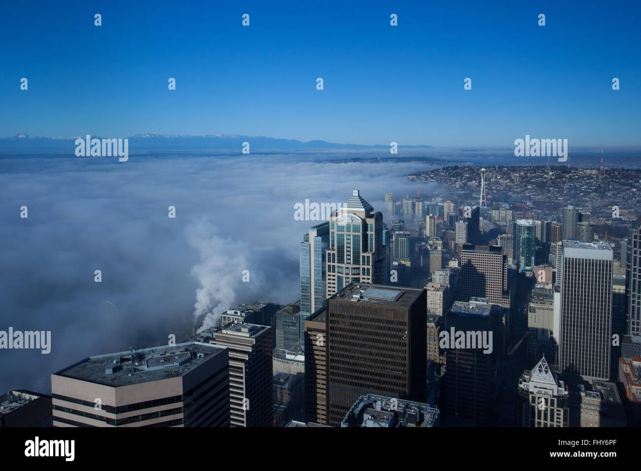 Seattle emerging from fog on sunny day Stock Photo - Alamy