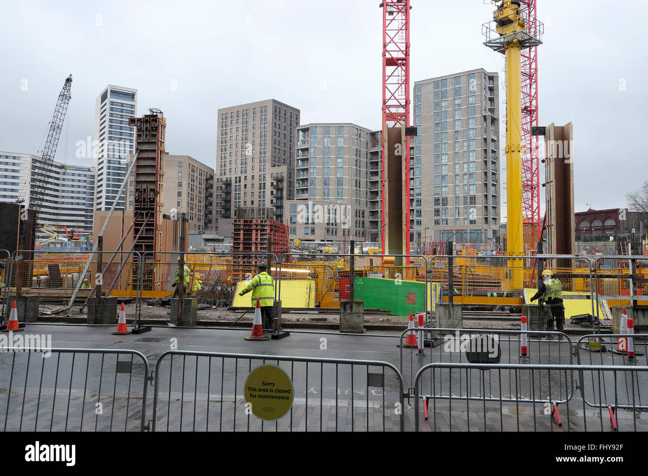 High rise residential tower blocks & cranes on skyline near housing ...