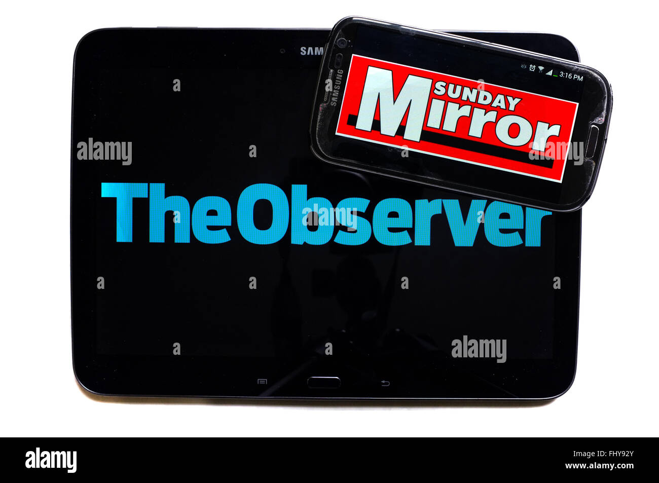 The logos of The Observer and the Sunday Mirror newspapers displayed on ...