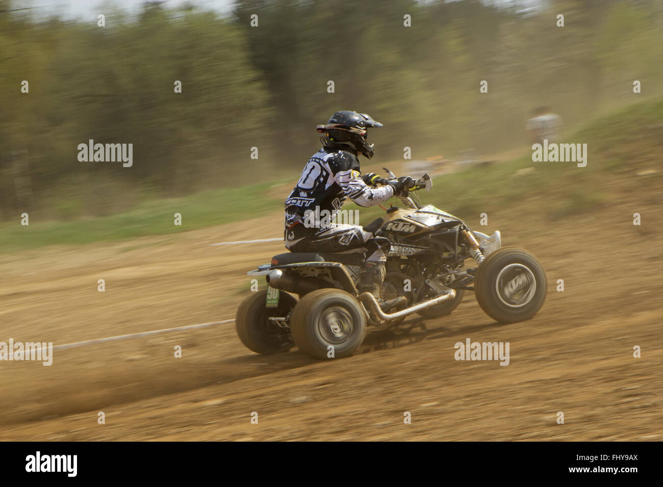 Racer is riding a quad motorbike Stock Photo - Alamy