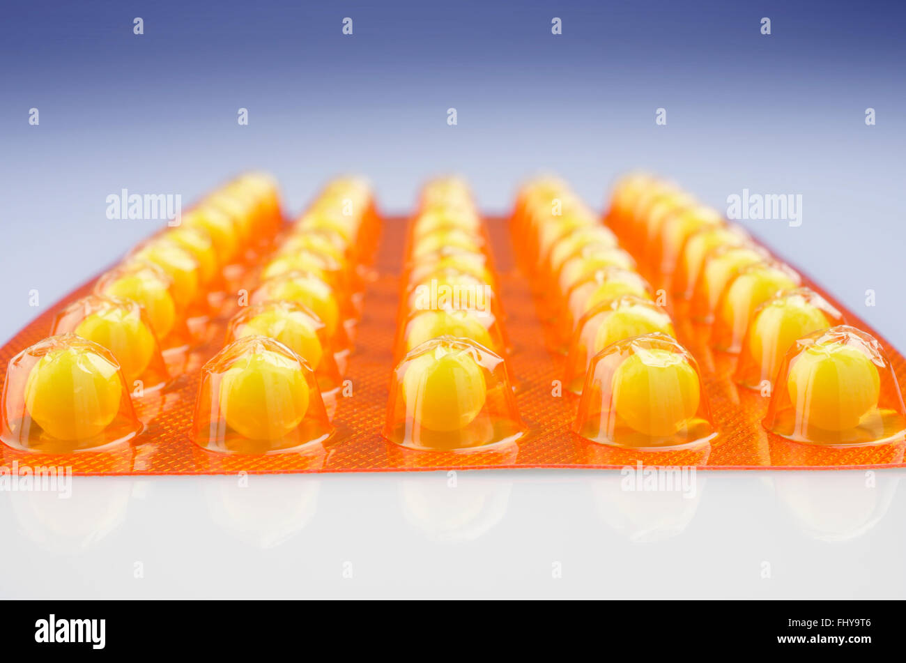Pack of yellow tablets Stock Photo - Alamy
