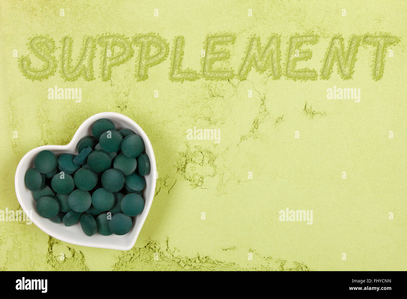 Dietary supplement. Green food supplement. Word supplement. written in ...