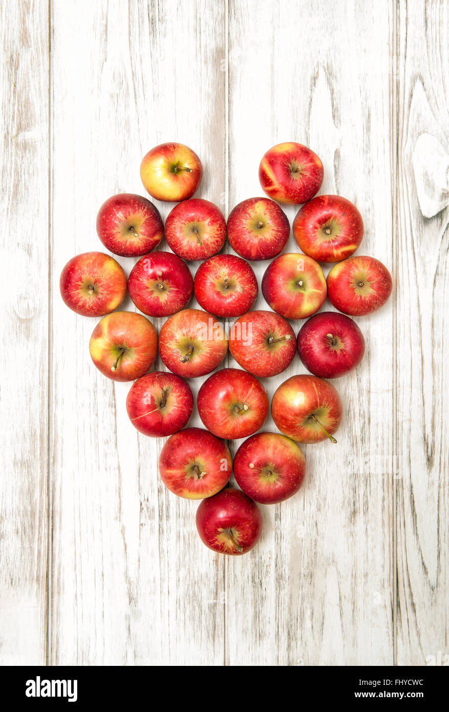 Apples heart over bright wooden background. Love and Valentines Day ...