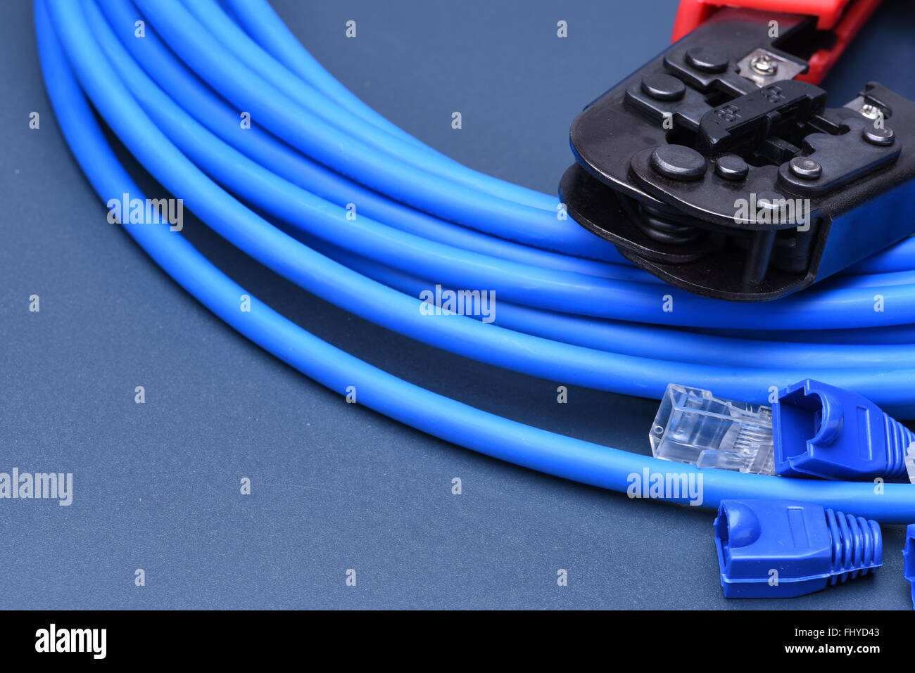Crimping tool with cable for computer network Stock Photo - Alamy