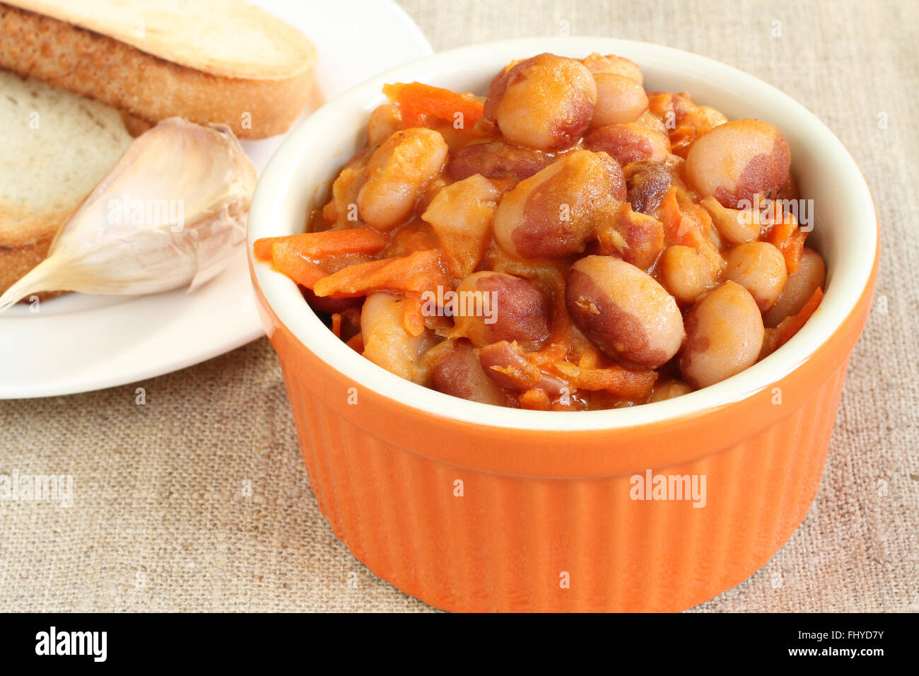 Kidney beans ragout with carrot, onion and tomato dressing in orange ...