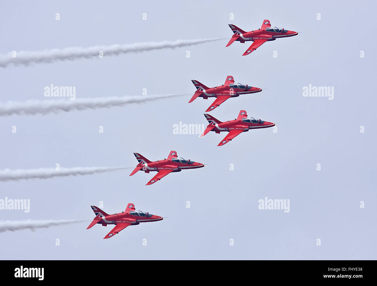 RAF Aerobatic Team The Red Arrows performing over RAF Coningsby Stock ...