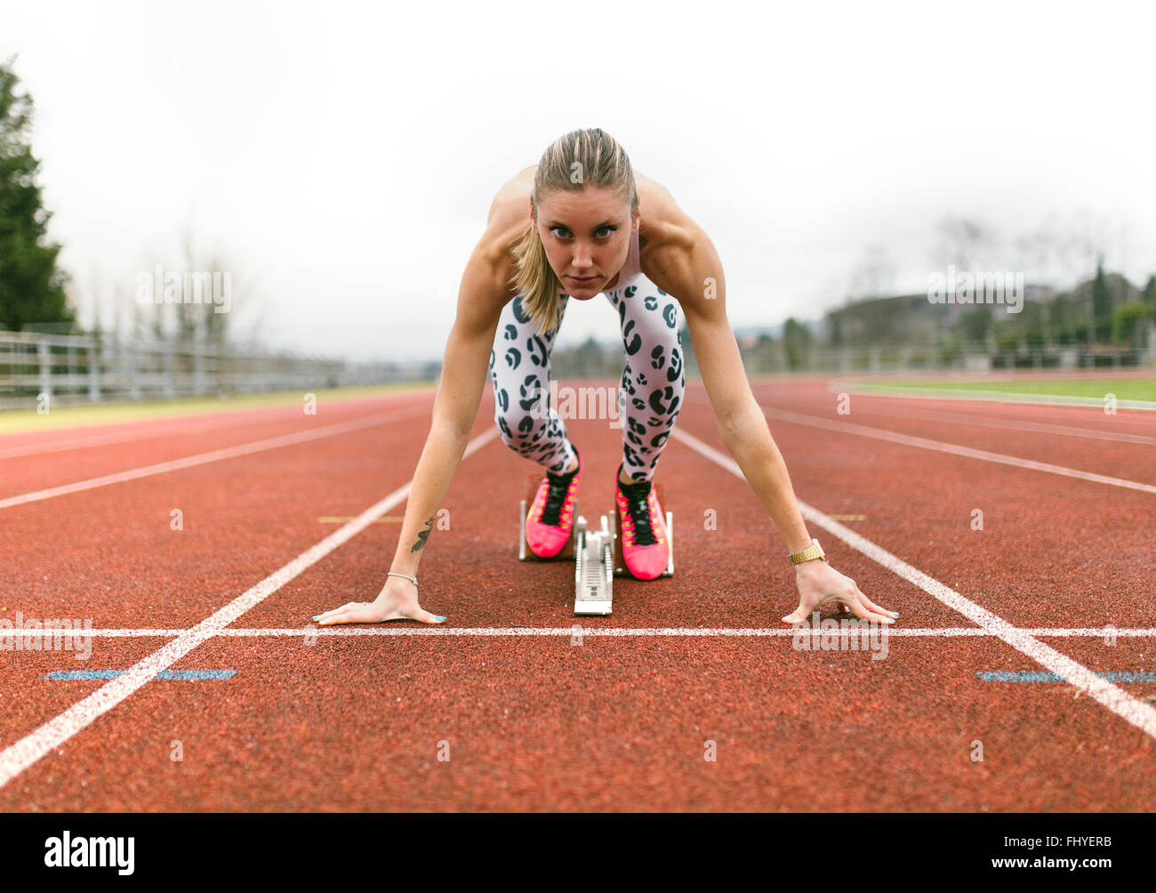 Athlete woman on a running track Stock Photo - Alamy