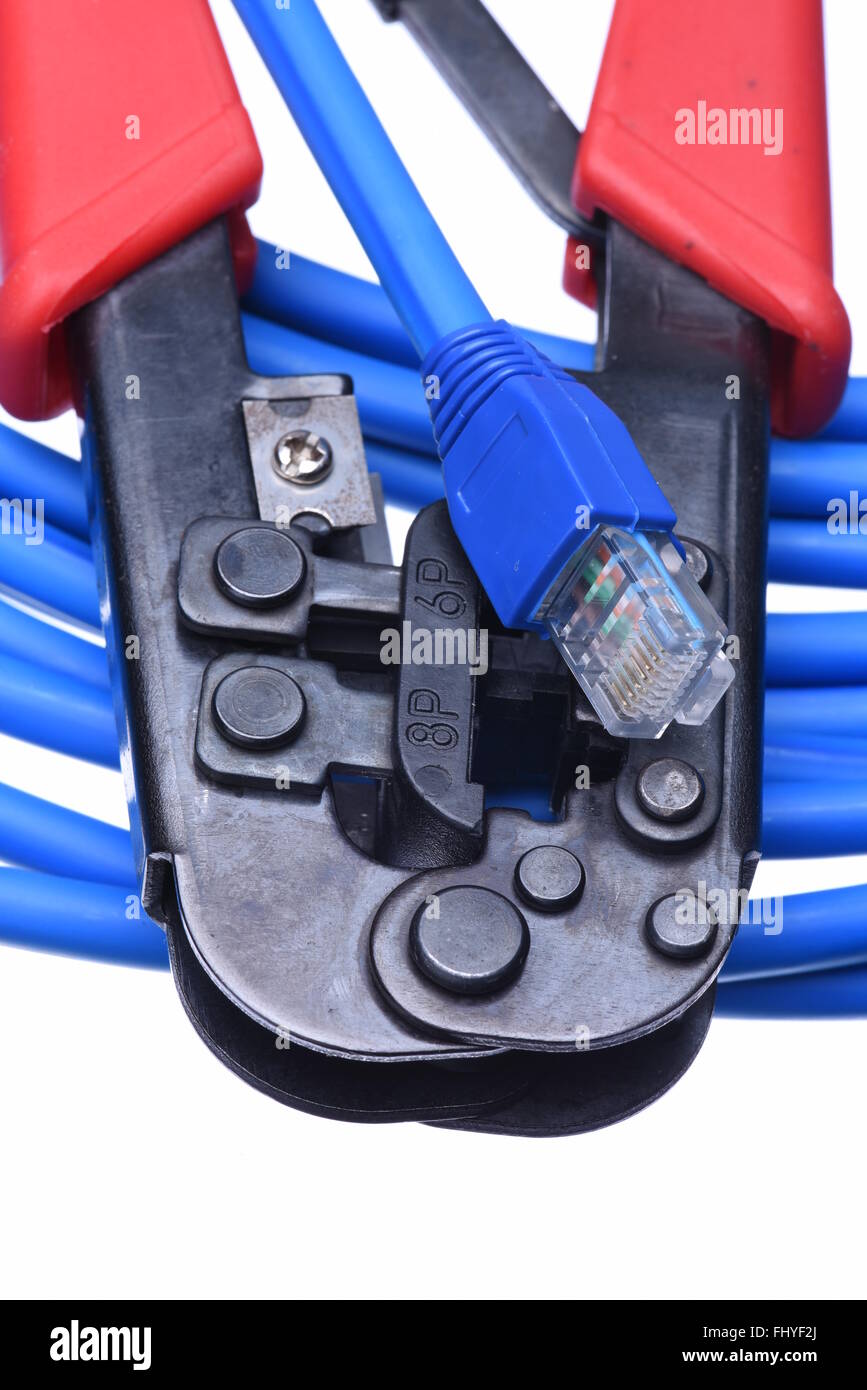 Crimping tool with network cable isolated on white background Stock ...