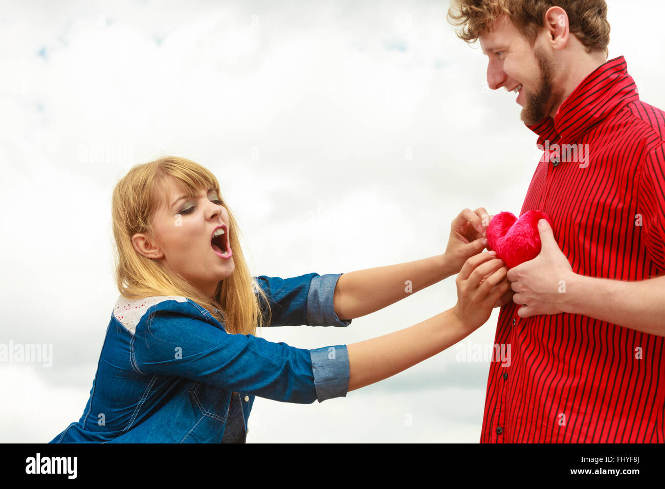 Love and envious concept. Woman and man young couple outdoor, emotional ...