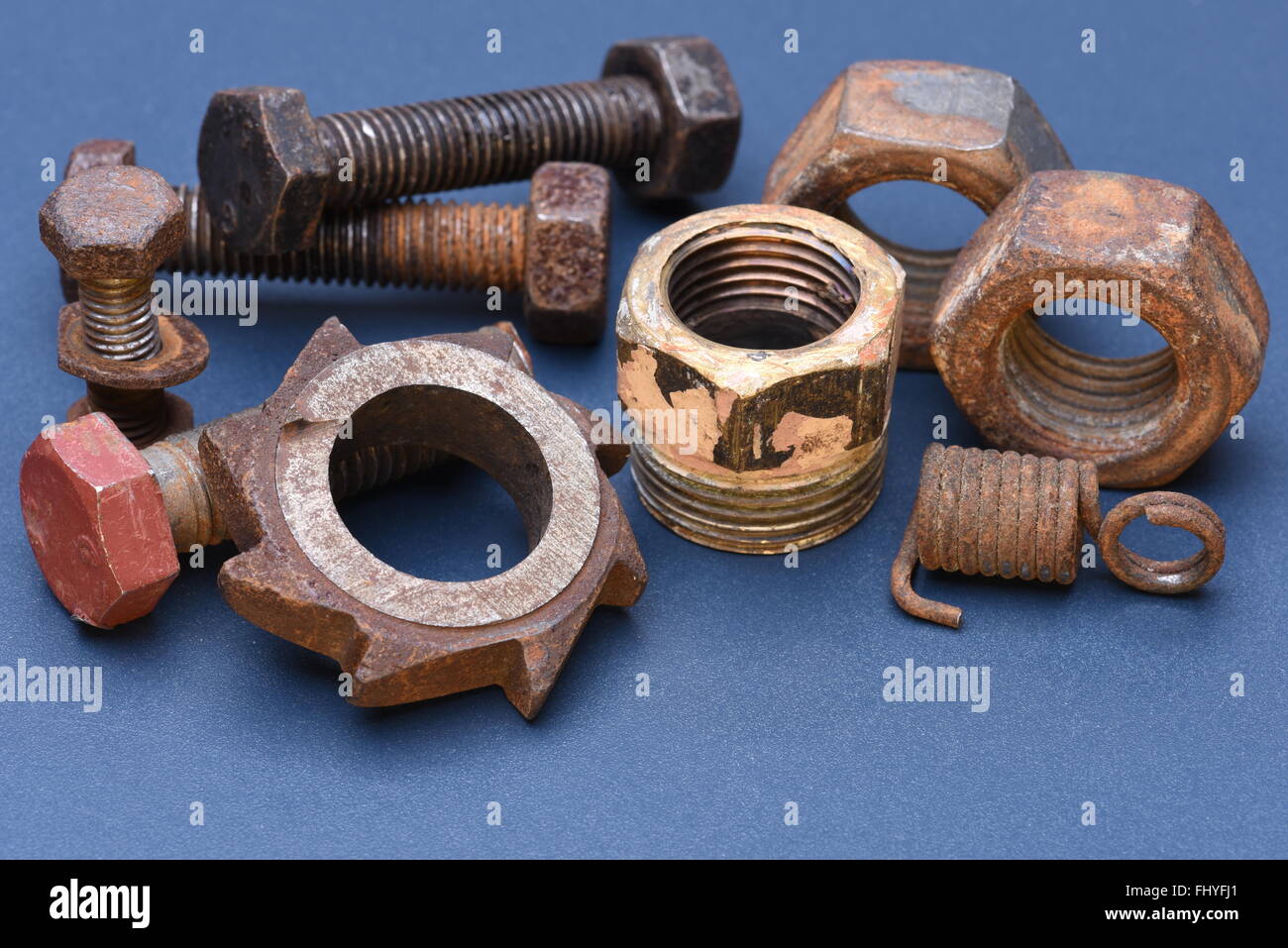 Old mechanical parts on blue metal background Stock Photo - Alamy