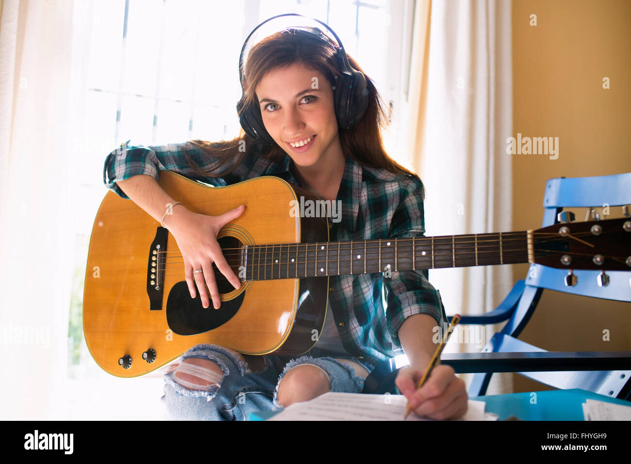 Female guitar sheet music hi-res stock photography and images - Alamy