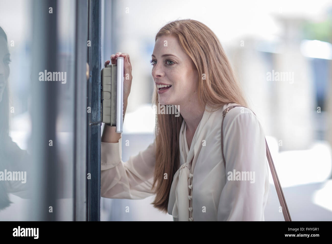 Woman young intercom door hi-res stock photography and images - Alamy