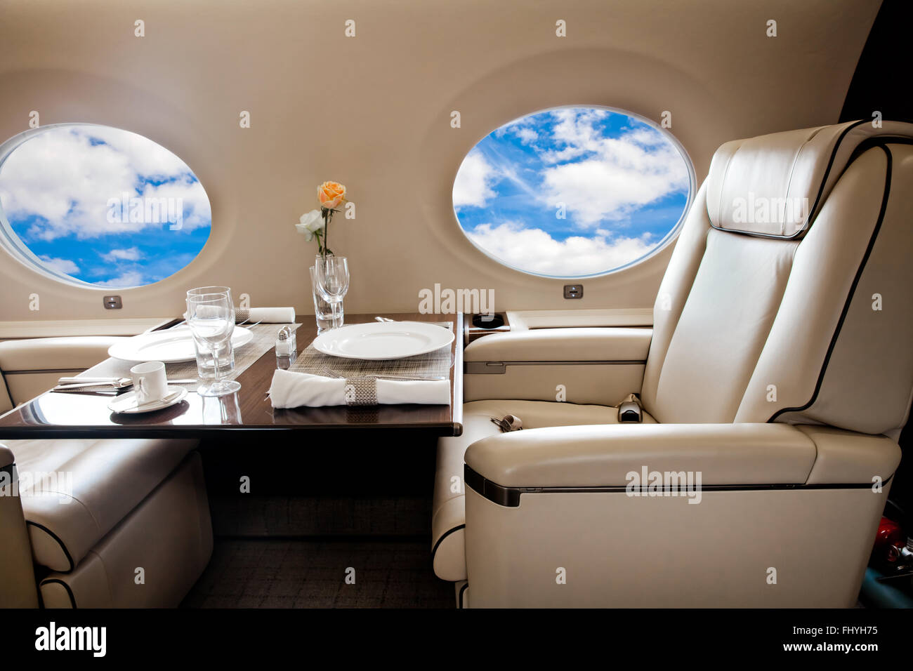 Flying by business class aircraft Stock Photo - Alamy