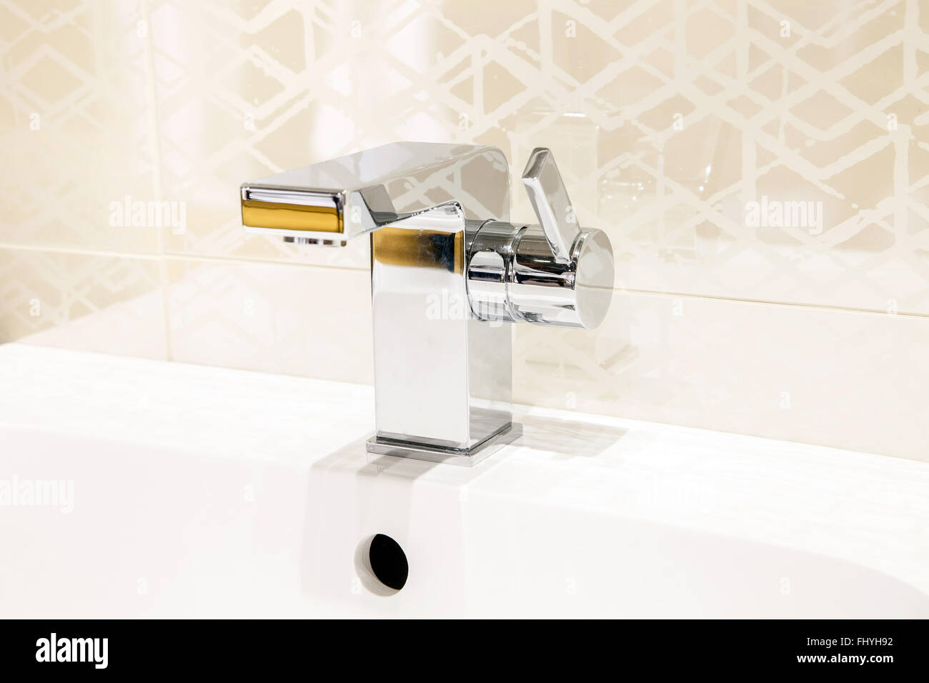 Modern silver faucet Stock Photo - Alamy