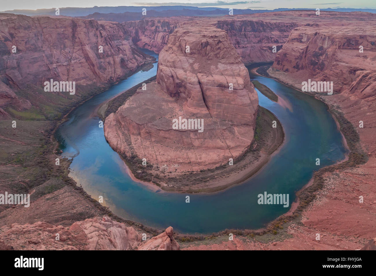 Horseshoe Bend / Overlooking red rock canyons that has blue and green ...