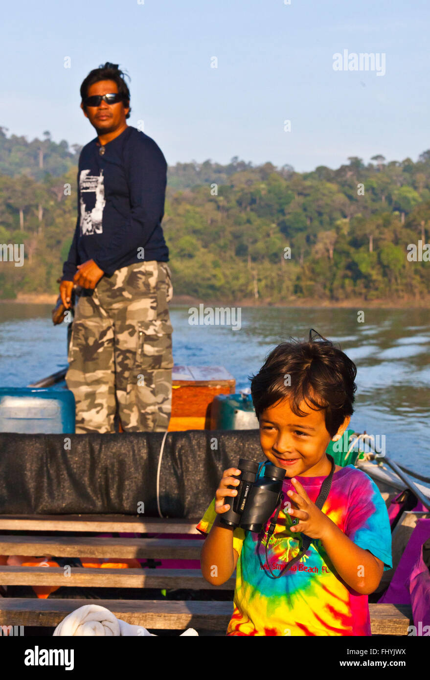 VAJRA GARRETT LOVELL with binoculars on CHEOW EN LAKE in the KHAO SOK ...