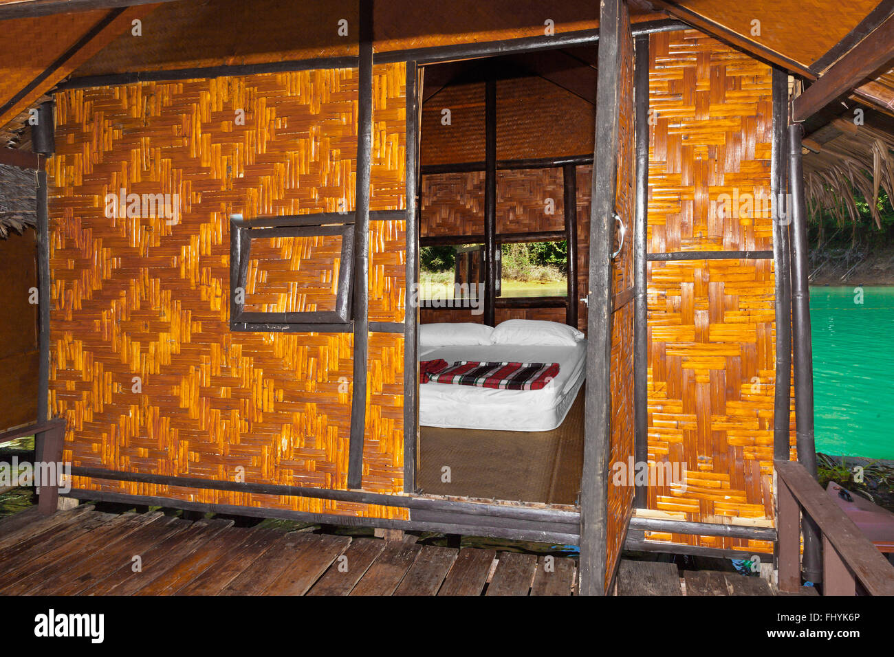 Interior of bedroom at NANG PRAI RAFT HOUSE on CHEOW EN LAKE in the ...