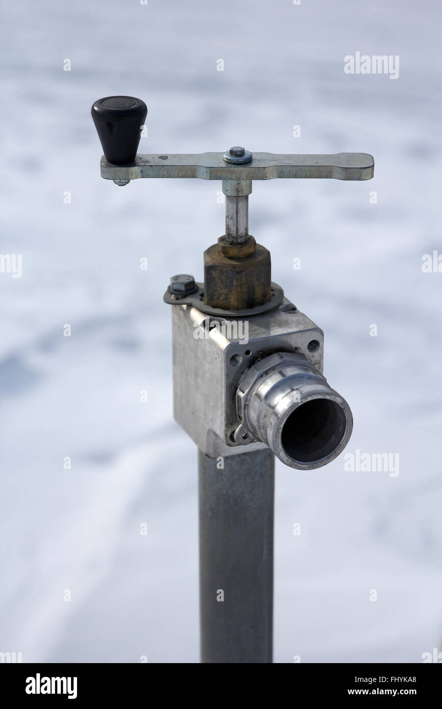 Faucet control water flow on a white background Stock Photo - Alamy