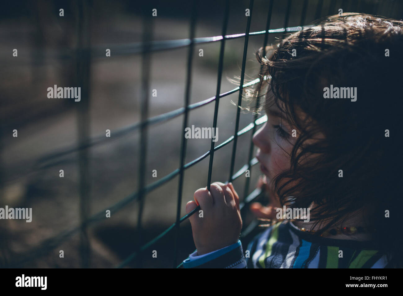 Sad lonely child behind hi-res stock photography and images - Alamy