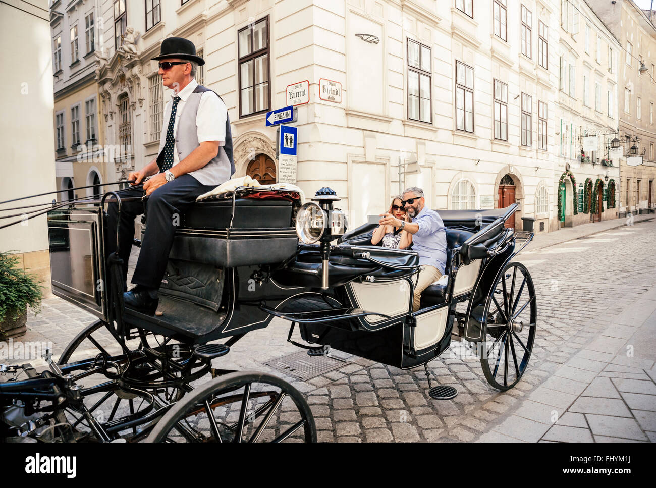 Couple in love sitting in a fiaker hi-res stock photography and images ...