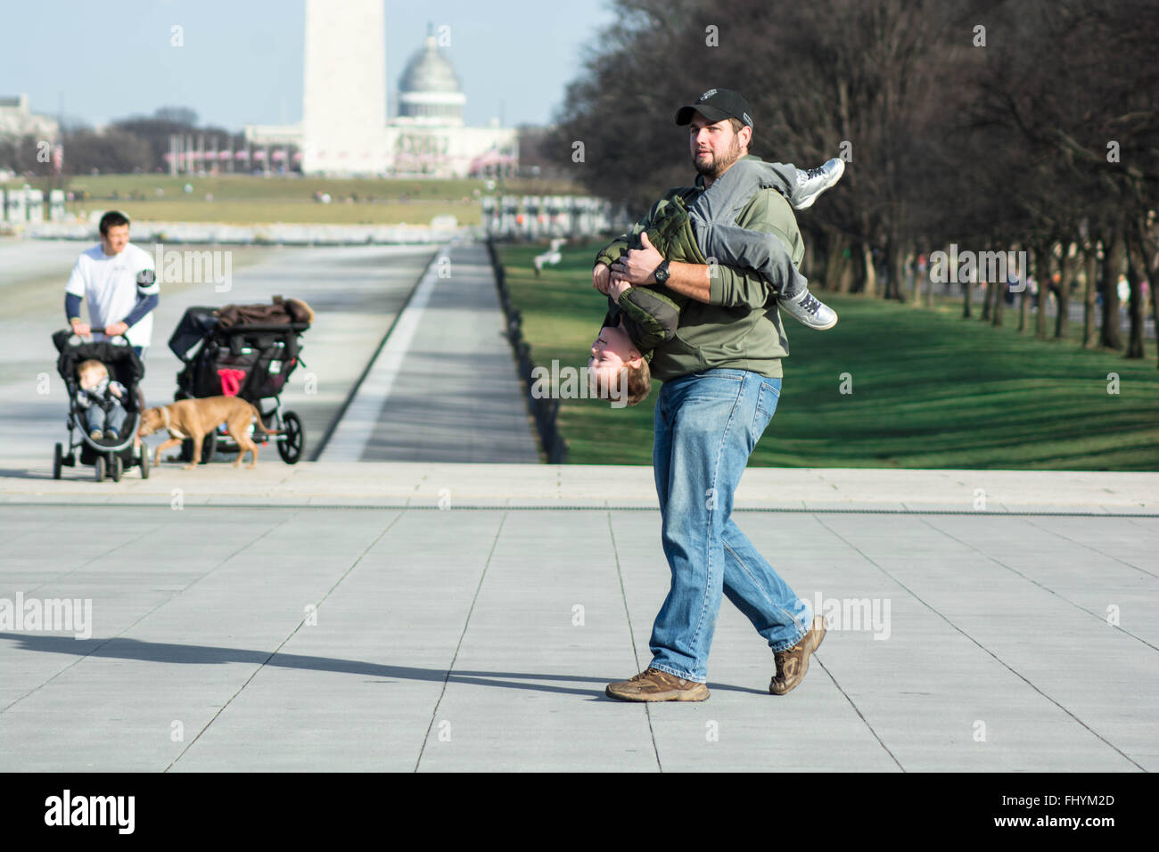 Proud father carrying his child Stock Photo - Alamy