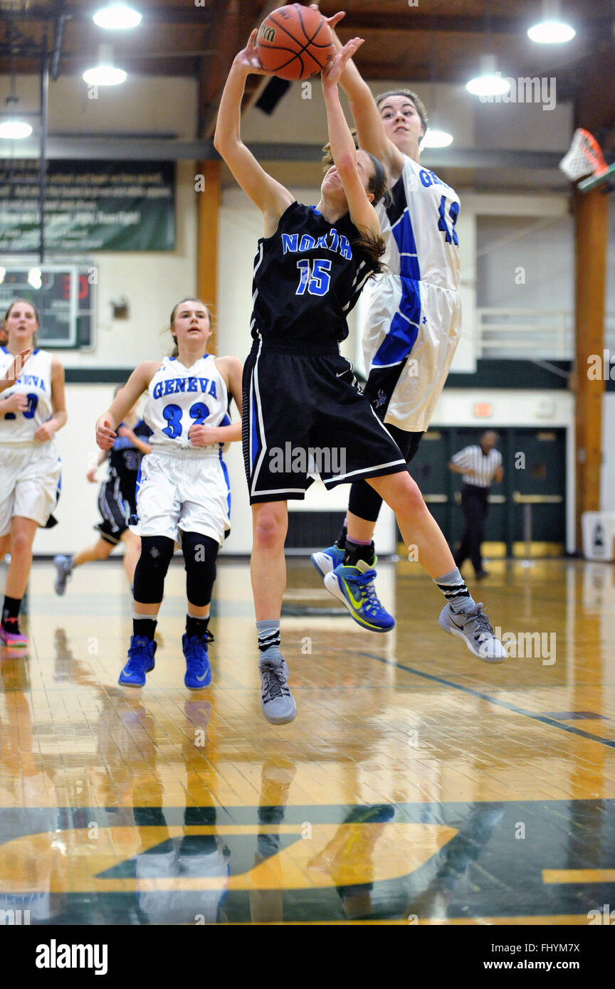 Player having a shot blocked from behind by a high-flying defender ...