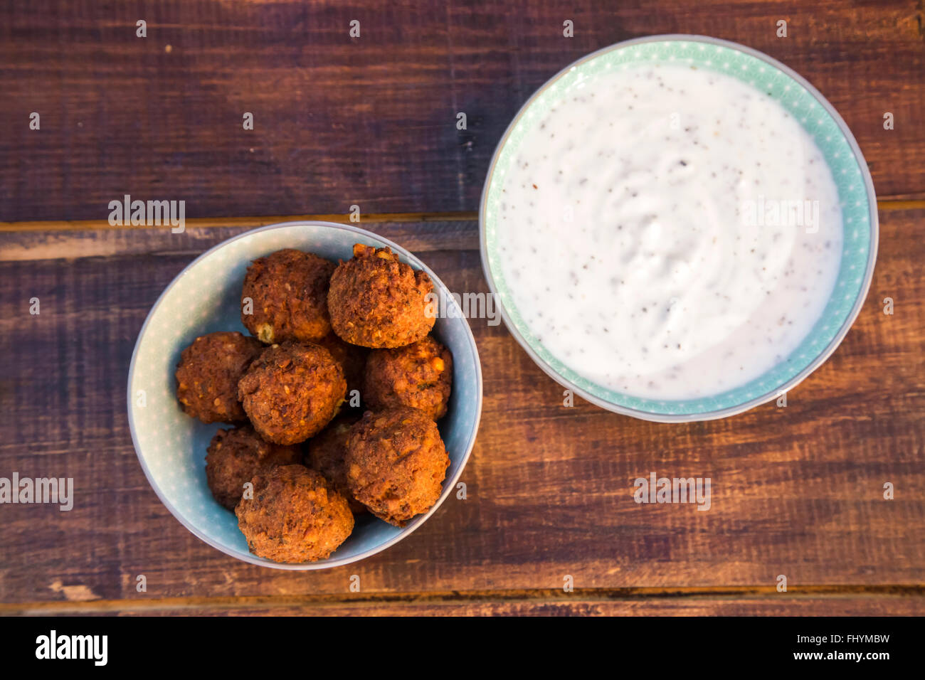 Preparation of falafel, vegetan falafel patties, joghurt in bowl Stock ...