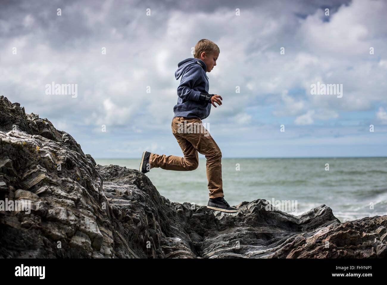 Child playing with rocks hi-res stock photography and images - Alamy