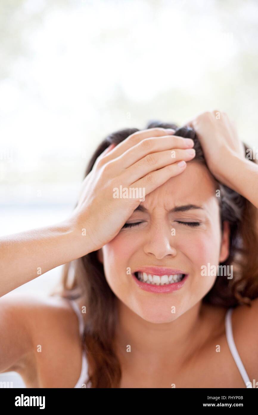 MODEL RELEASED. Woman with her hands in her hair Stock Photo - Alamy