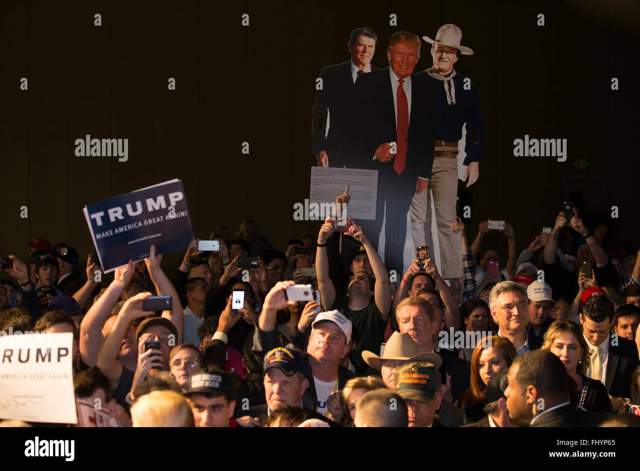 Supporters of Republican presidential candidate Donald Trump hold signs ...