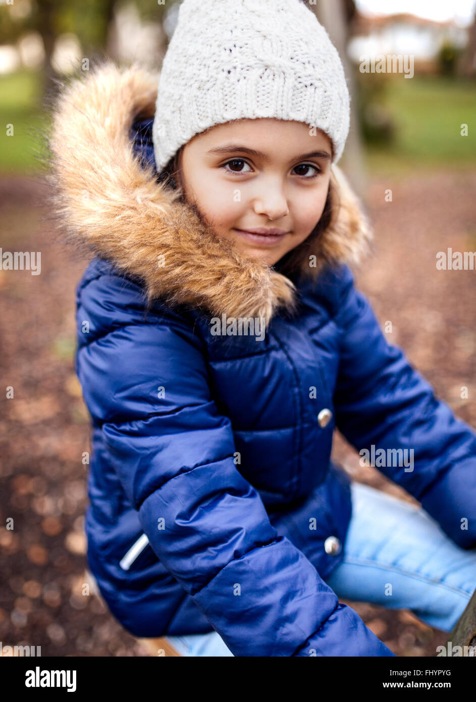 Portrait of little girl wearing blue jacket in autumn Stock Photo - Alamy