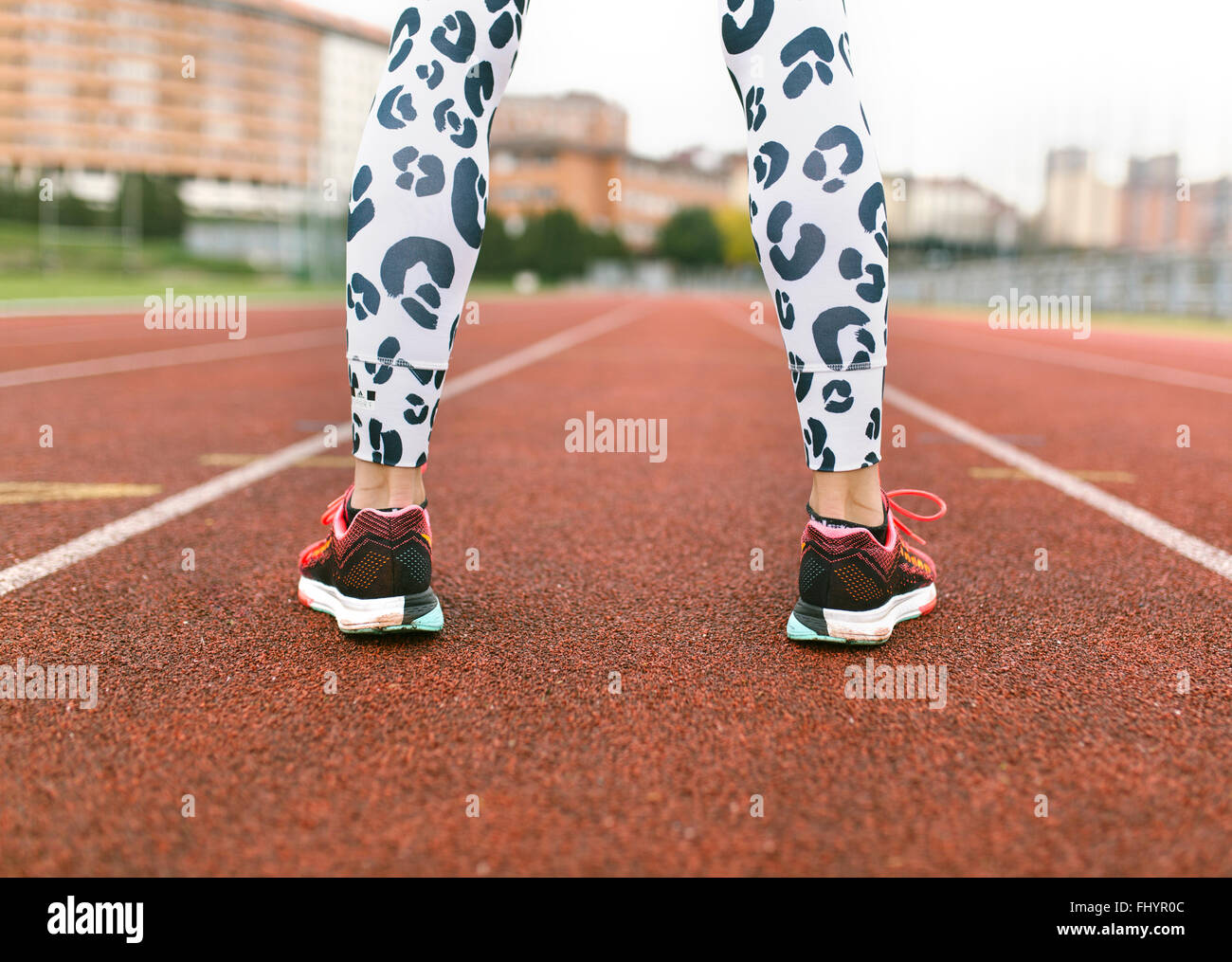 Athlete woman standing on a running track Stock Photo - Alamy