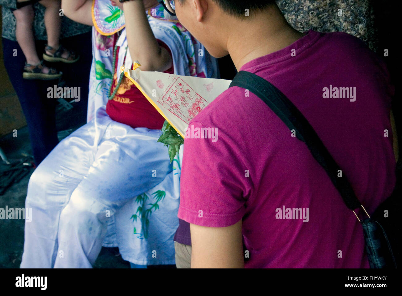 A man is holding a traditional Chinese pennant at a Chinese New Year ...