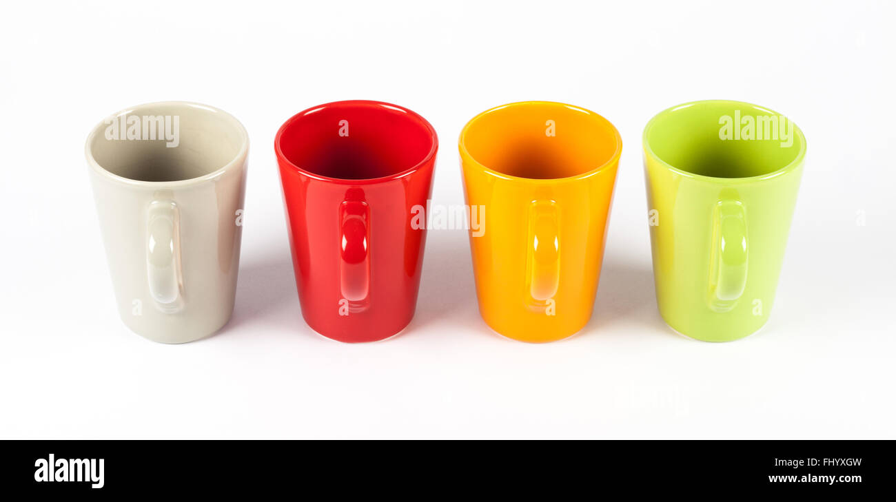 Four color tea cups shown in row white background Stock Photo - Alamy