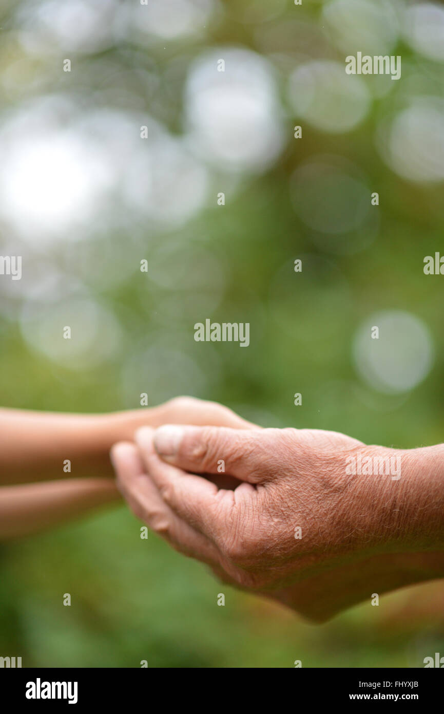 Hands held together Stock Photo - Alamy