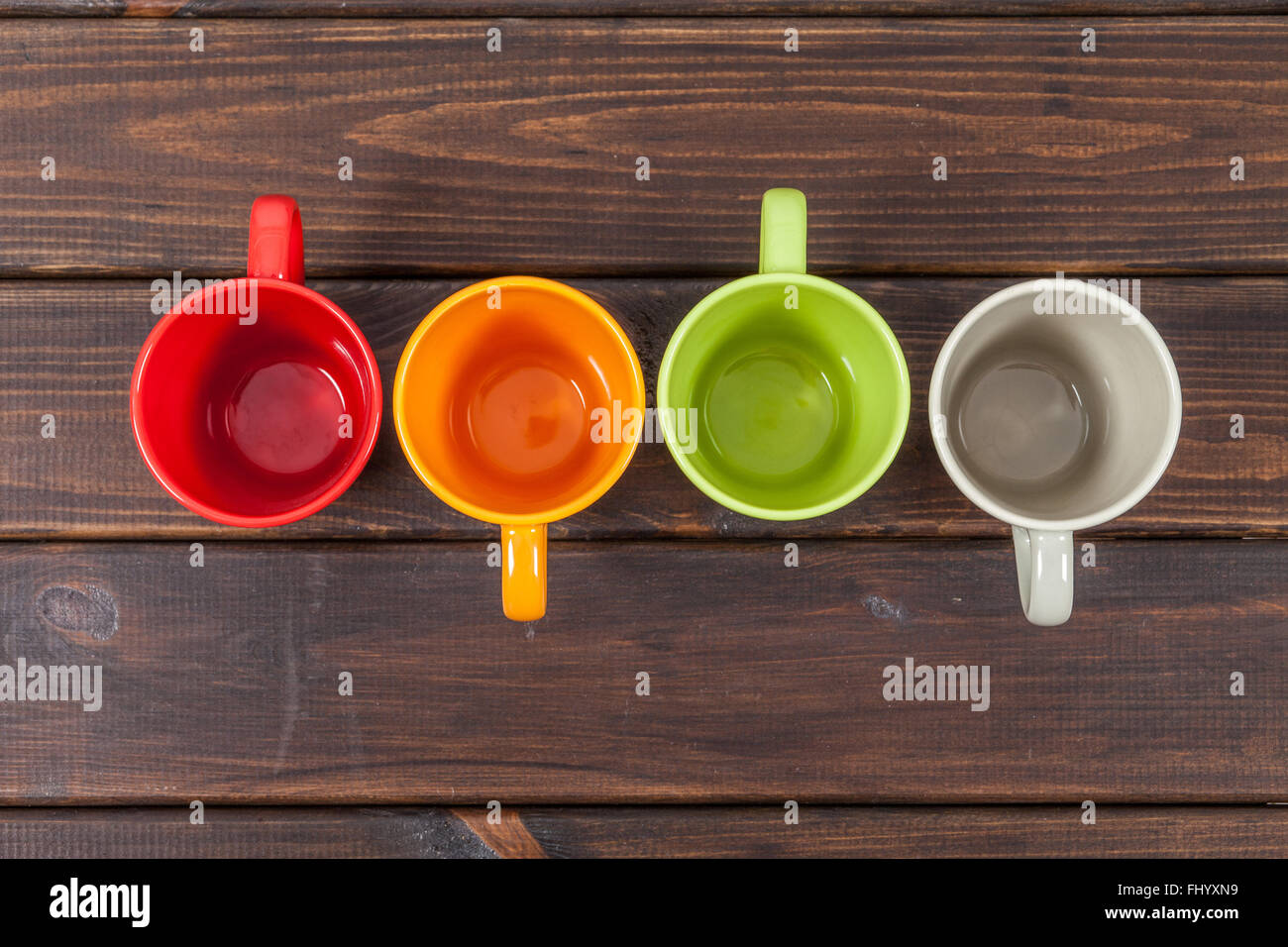 Four color empty tea cups arranged in one row - top view Stock Photo ...