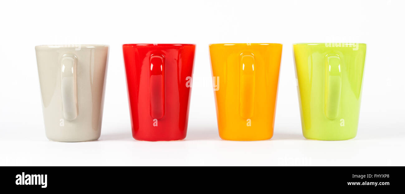 Four color tea cups shown in row on white Stock Photo - Alamy