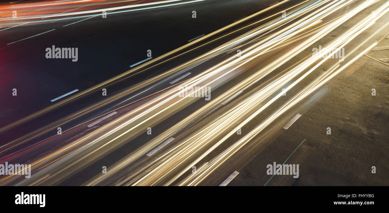 Long exposure light trails across road junction Stock Photo - Alamy