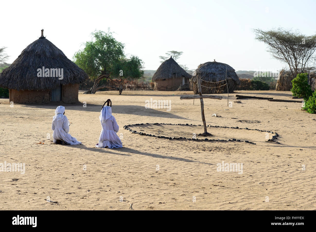 KENYA Turkana, Lodwar, two christian Turkana women pray in openair ...