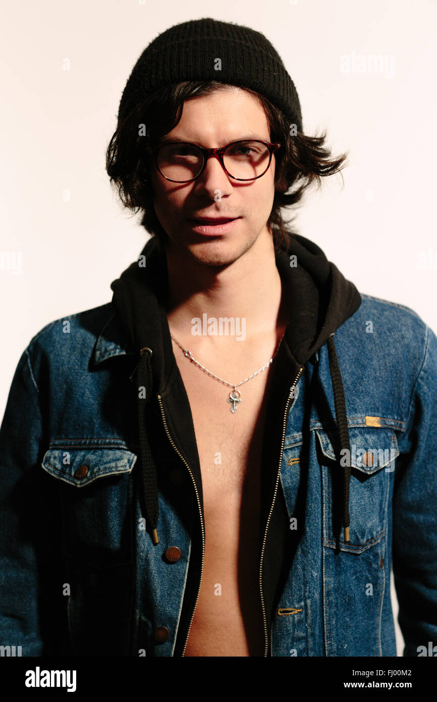 Modern fashionable young man in unbuttoned jacket Stock Photo - Alamy