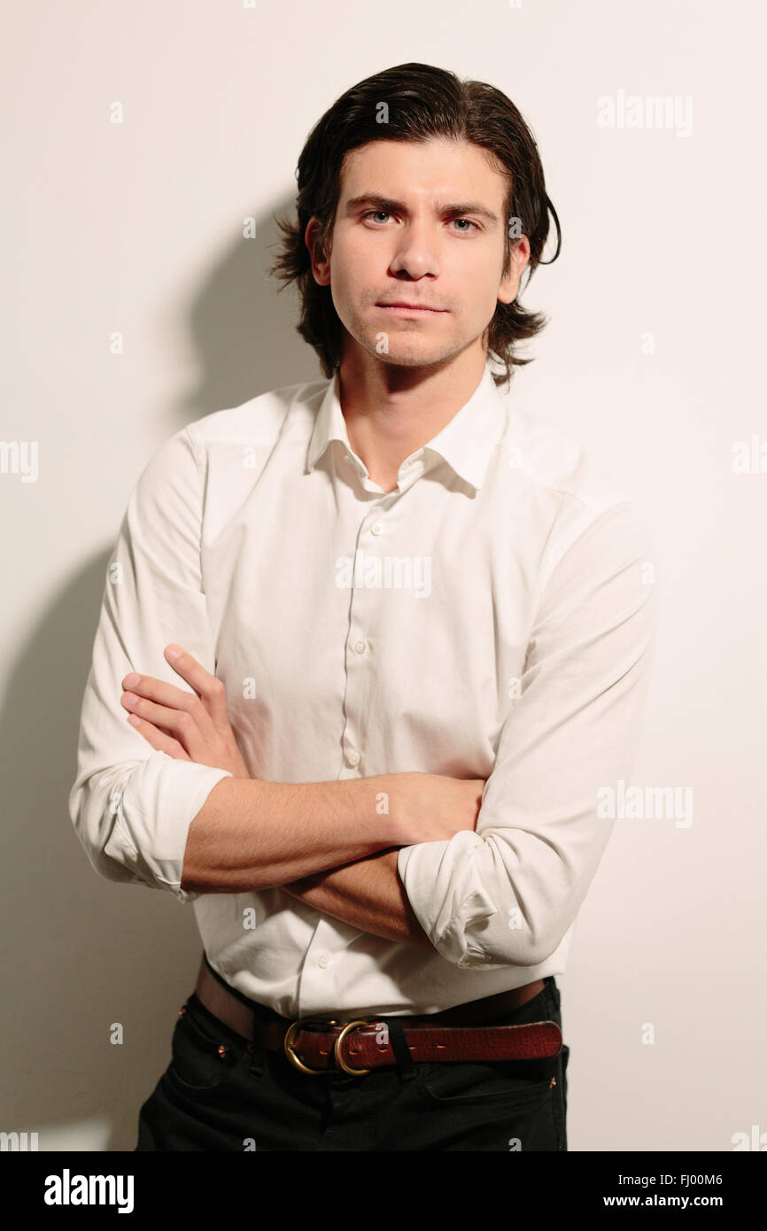 Young man folded his arms Stock Photo - Alamy Young man folded his arms Stock Photo - Alamy