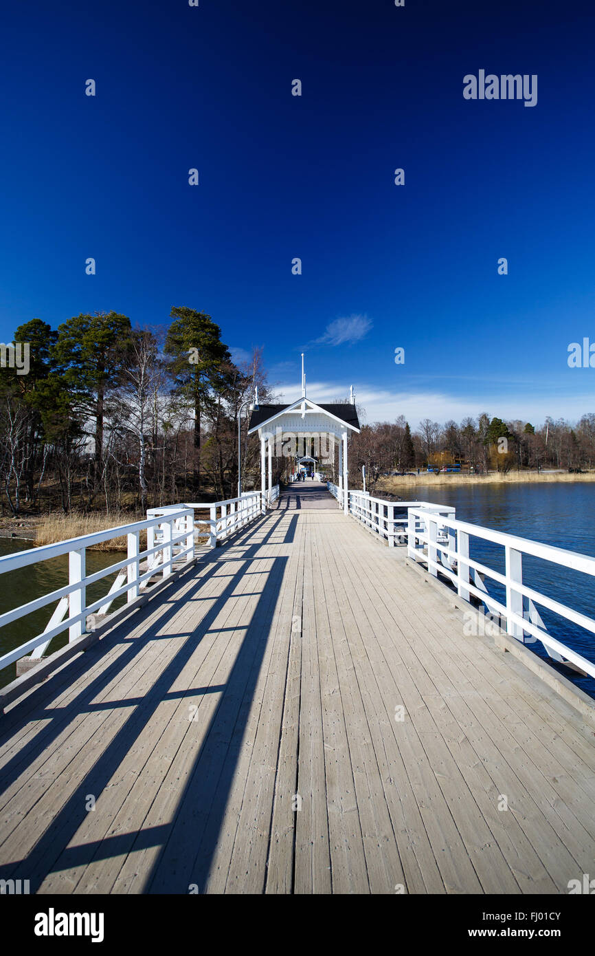 White wooden bridge with gates and deep blue sky Stock Photo - Alamy