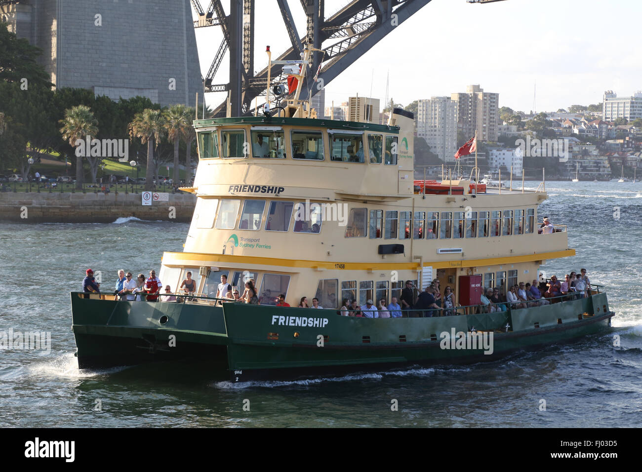 A Sydney ferry named, ‘Friendship’ makes its way past the Sydney ...