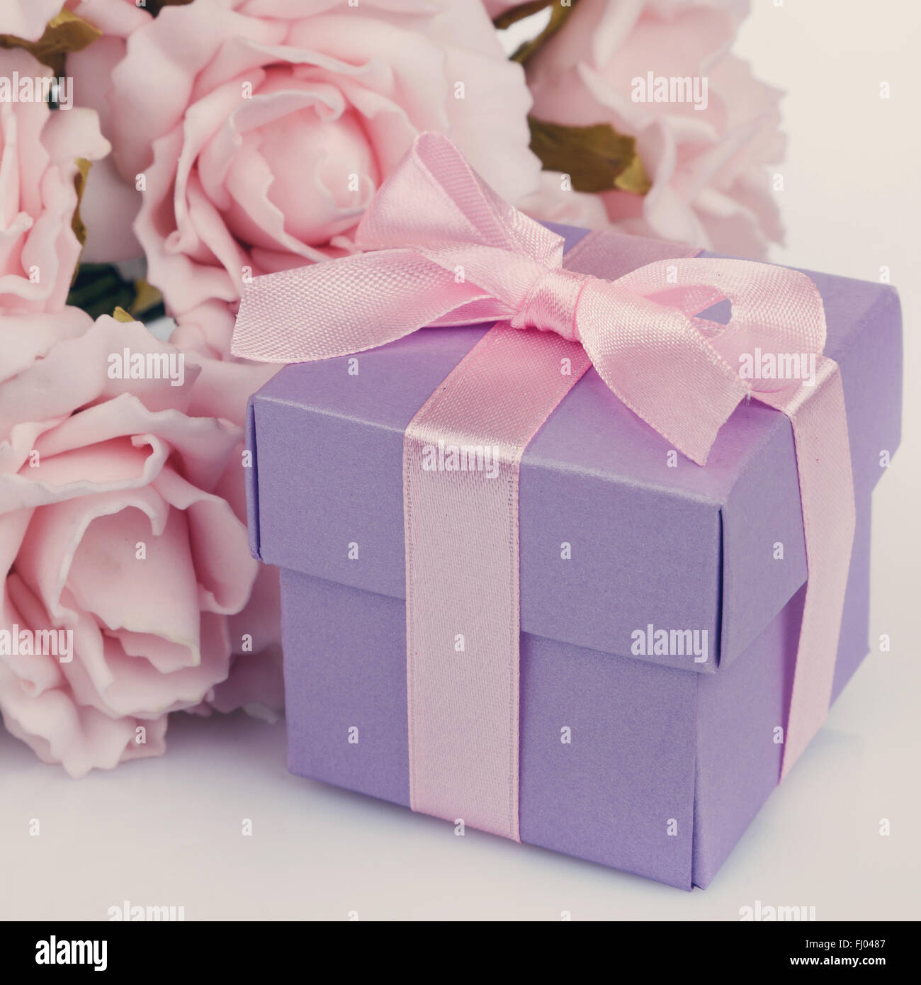 pink flowers and gift box Stock Photo - Alamy
