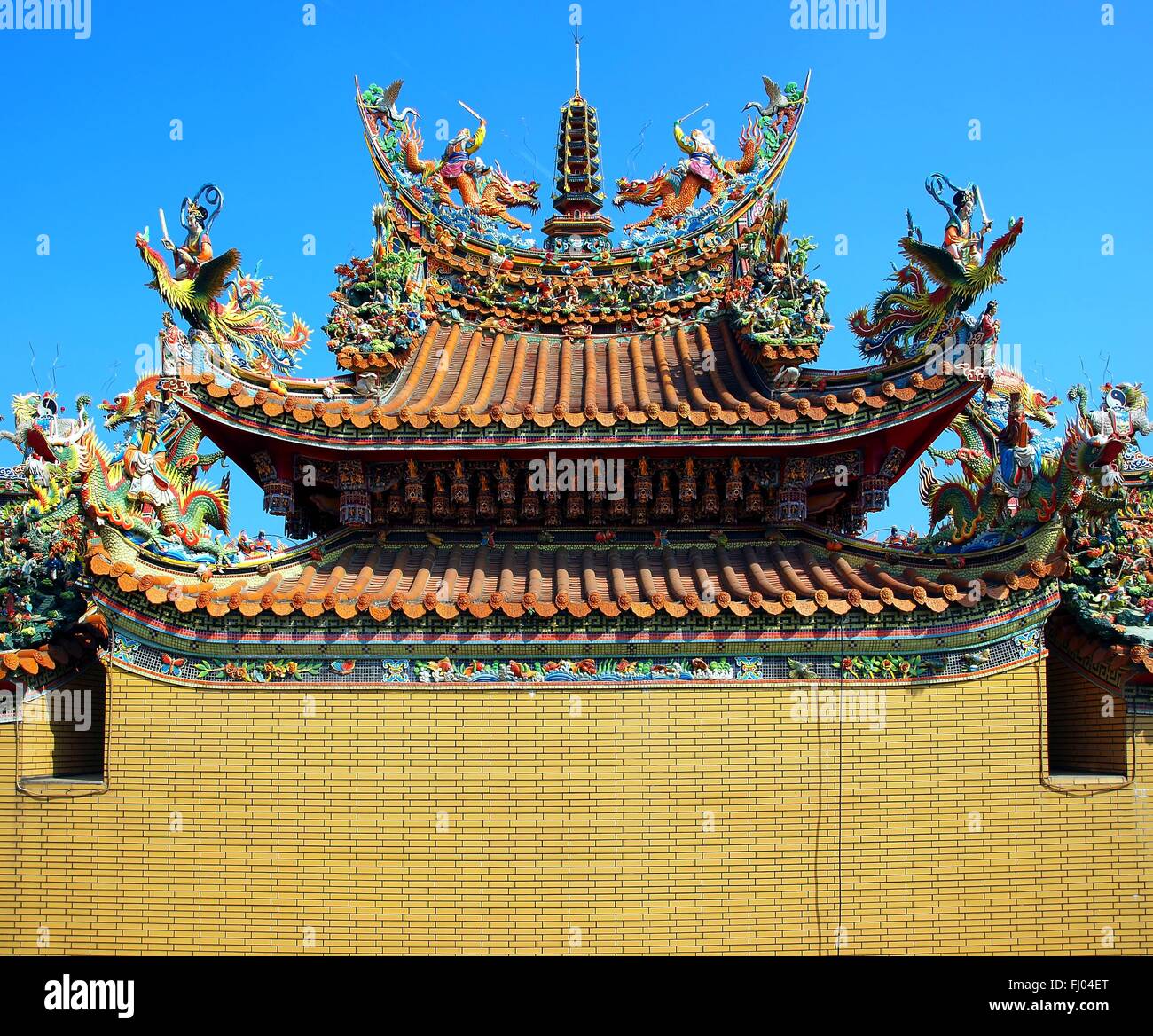 A Chinese temple with colorful ornaments of mythological beasts Stock ...